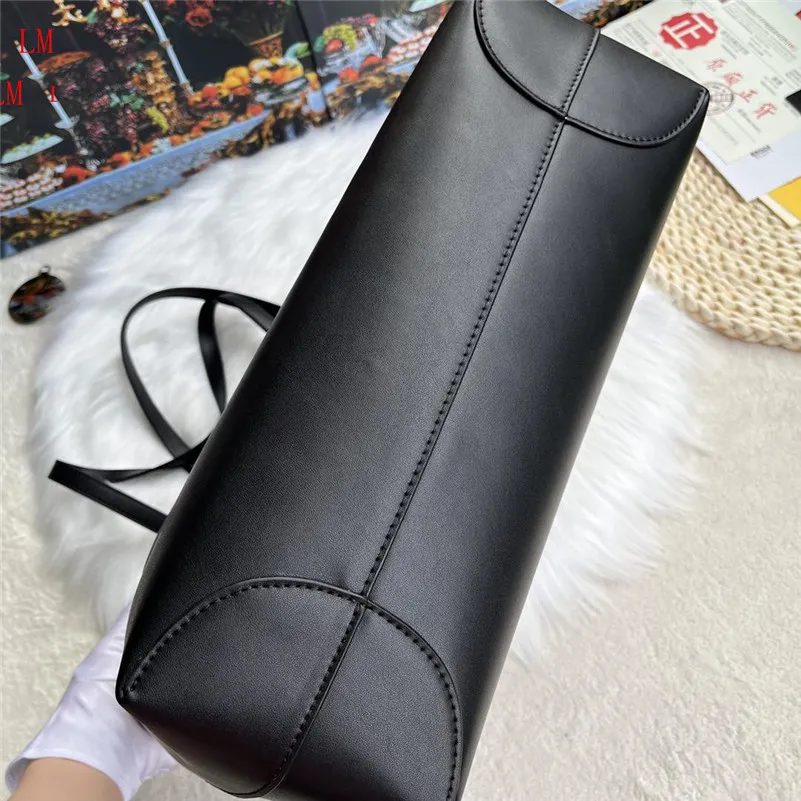 Embossed Black Leather Tote Bag with Pink Accents - Designer Luxury ...