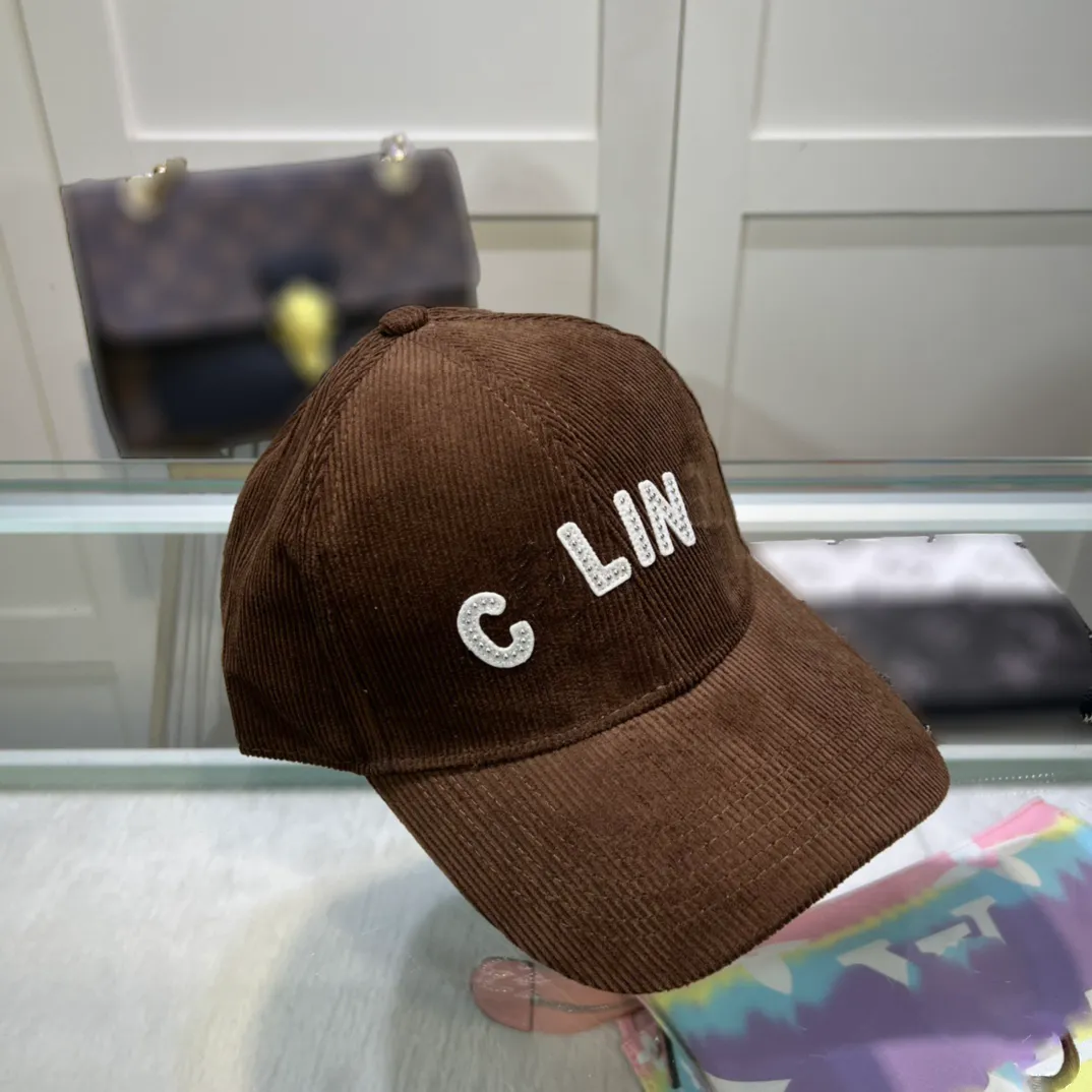 Designer unisex cotton baseball cap with embroidered letters and ...