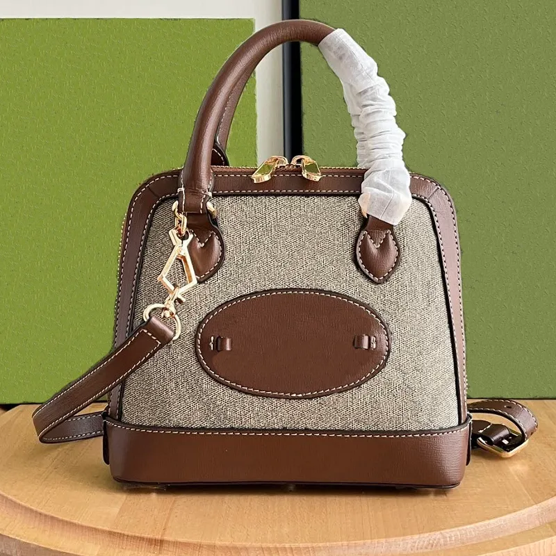 DHgate.com:Women's Mini Shell Handbag with Metal Buckle and Interwoven ...