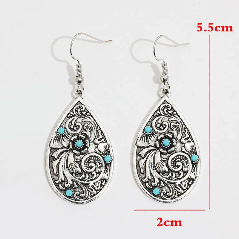 Water droplet shaped alloy earrings with inlaid tanzanite stone, silver ...