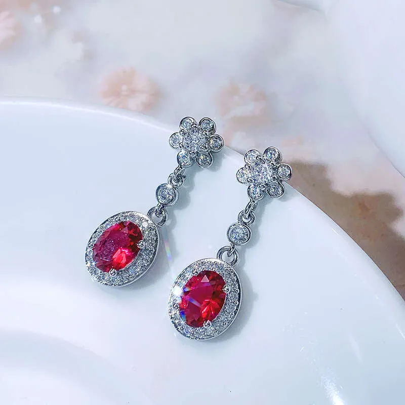 Red droplet-shaped copper-plated brass earrings with red peridot stone ...