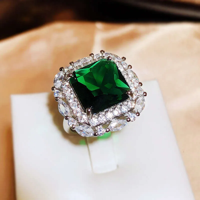 Zircon square opening index finger ring in yellow gold with green stone ...