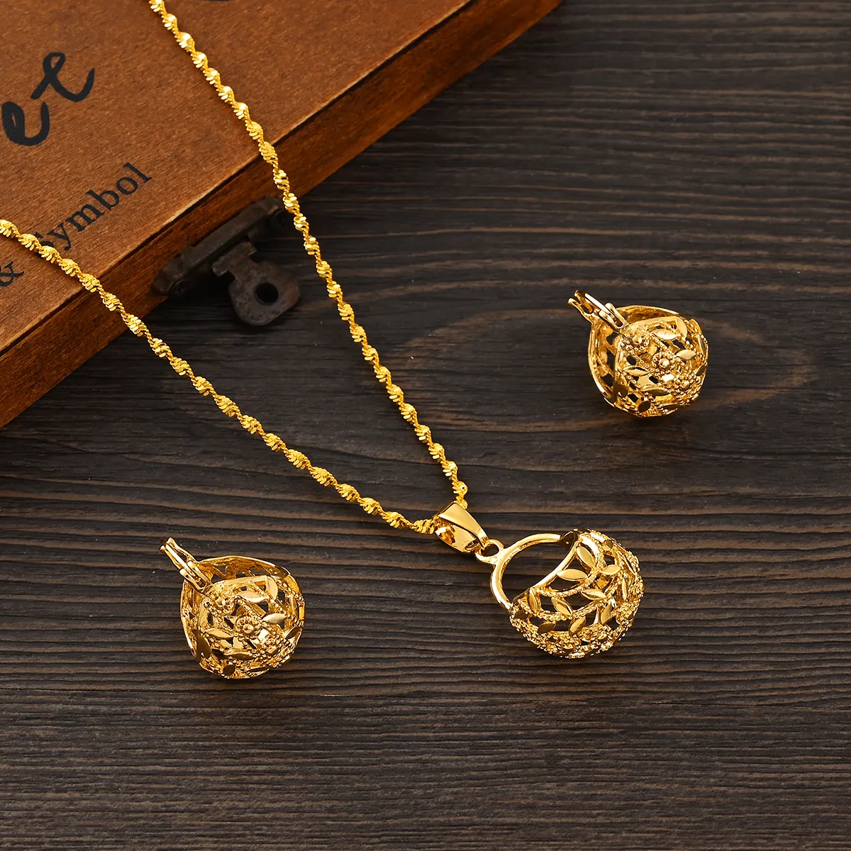DHgate.com:Exquisite Gold Hollow Flower Necklace and Earrings Set for ...