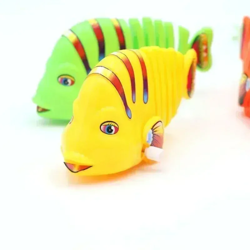 DHgate.com:Colorful Plastic Wind-Up Fish Toy | Classic Spring Running ...