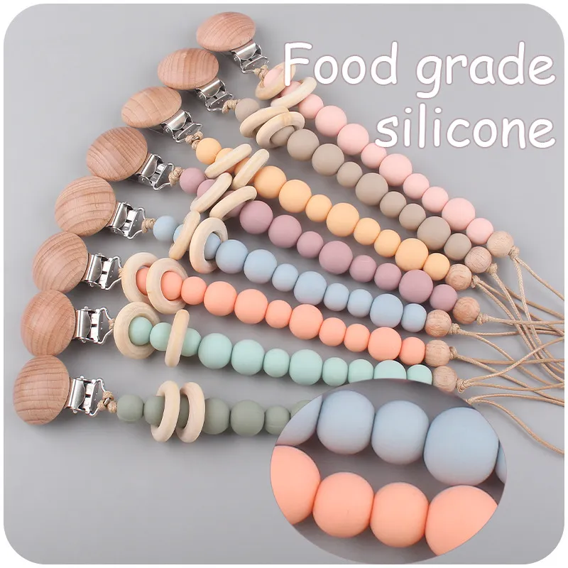 DHgate.com:Baby Silicone Pacifier Clips with Colorful Wooden Ring ...