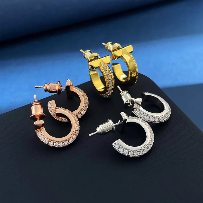 Delicate alloy earrings with cubic zirconia stones featuring T-shaped ...