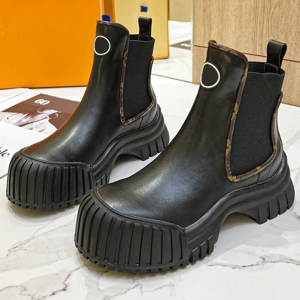 Classic Ruby Flat Ankle Boot With Rubber Sliders Outsole And Brand ...