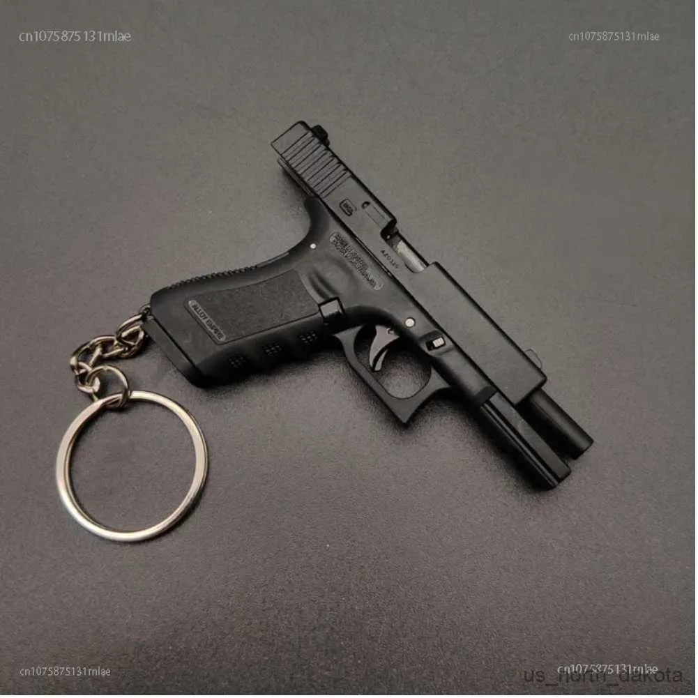 DHgate.com:Alloy Metal Keychain Gun Model Ornament: Detailed Miniature ...