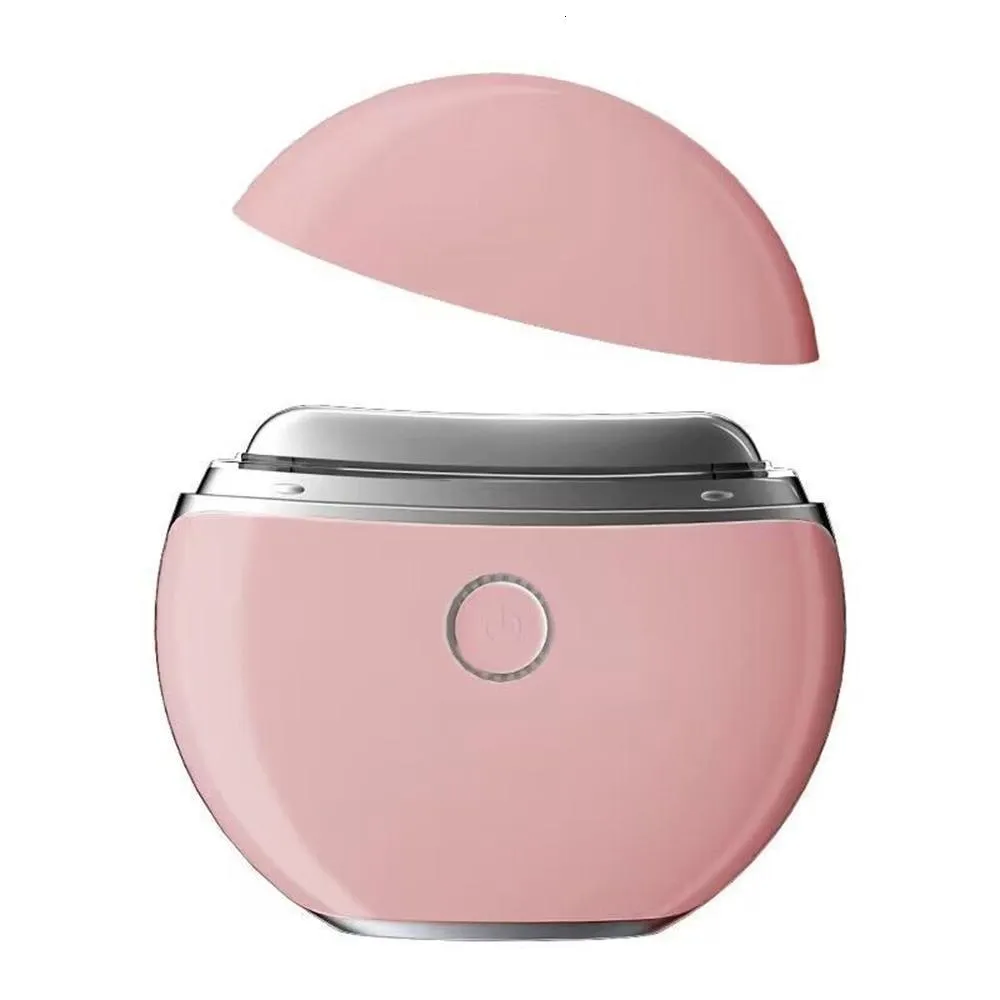 Electric massager on face with Heating, Massage, Scraping, and ...
