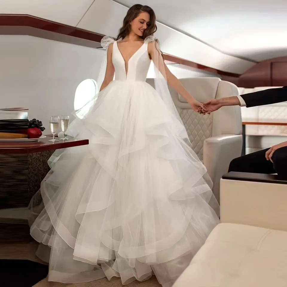 Elegant V-Neck Tulle Wedding Dress: Ruffle Back, Sleeveless & Sweep ...