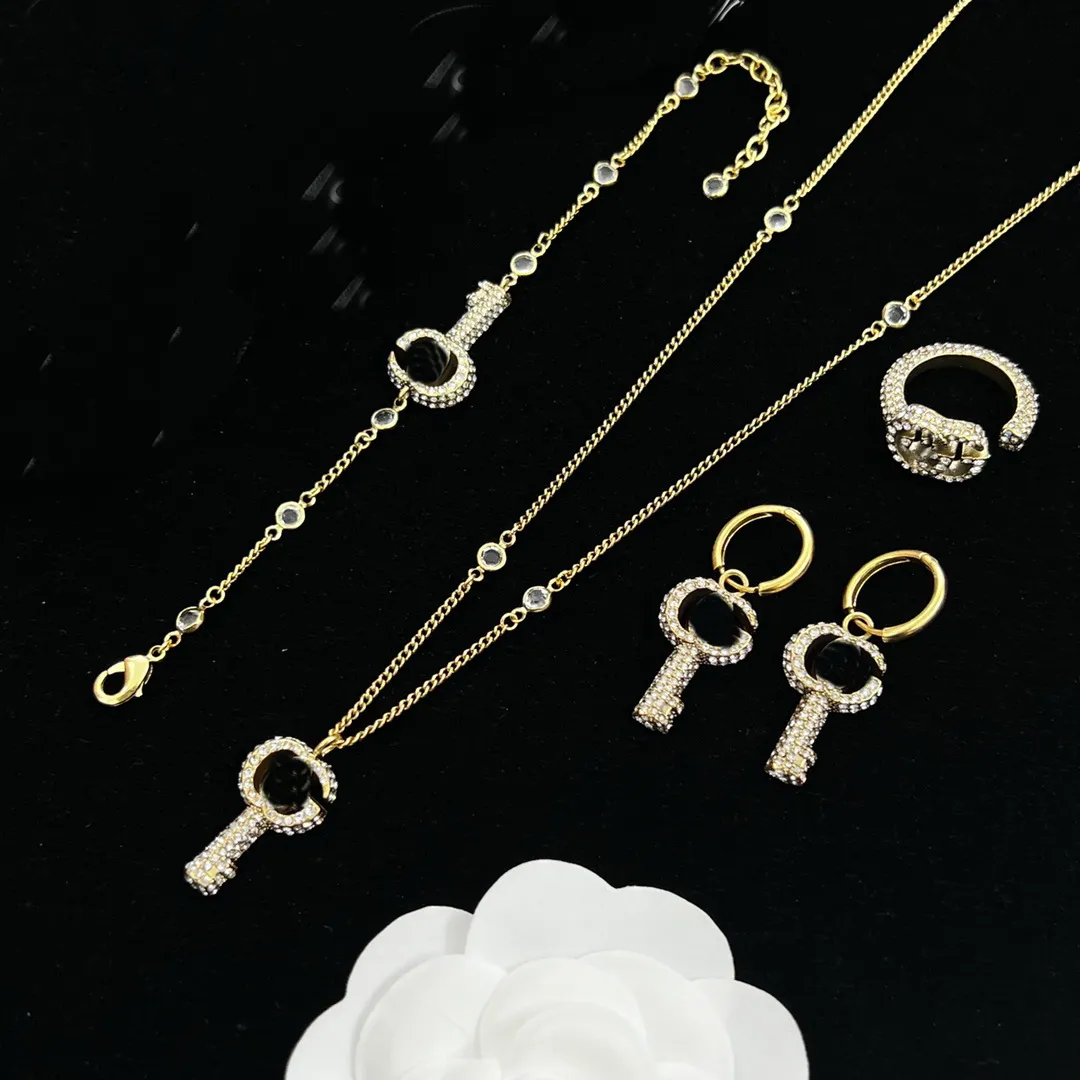 Designer Jewelry for Women: Crystal Embellished Key Pendant Necklace ...