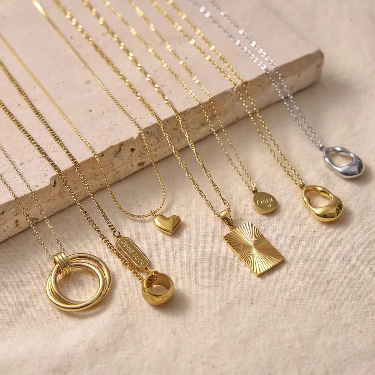 Gold-plated pendant necklace with sterling silver base and matte finish ...