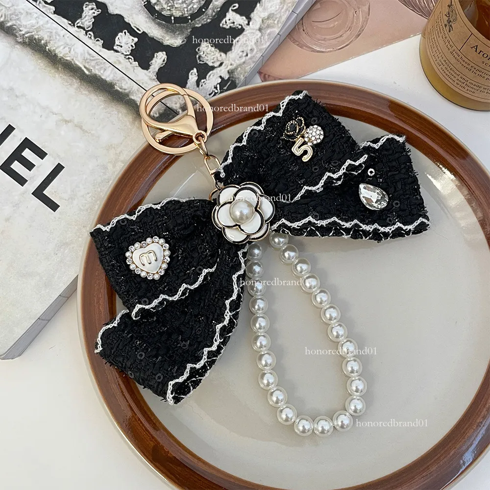 Korean Version Small Orange Camellia Pearl Chain Bowknot Car Keychain ...