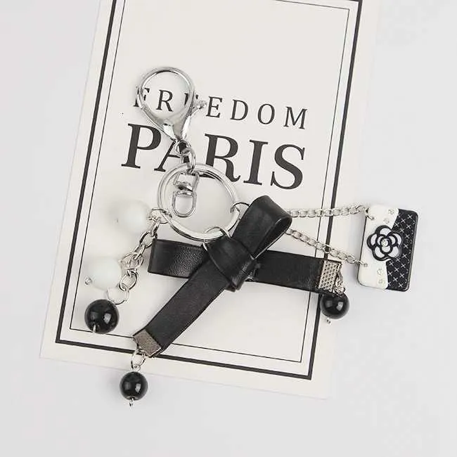 Camellia Pearl Flower Bowknot Keychain Pendant with Fur Ball and ...