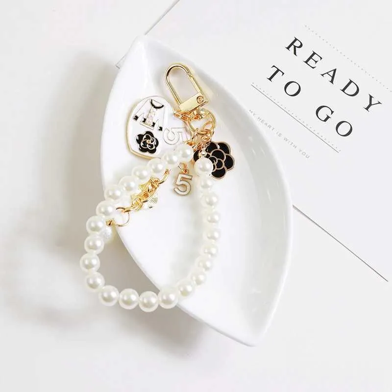 Camellia Pearl Flower Bowknot Keychain Pendant with Fur Ball and ...