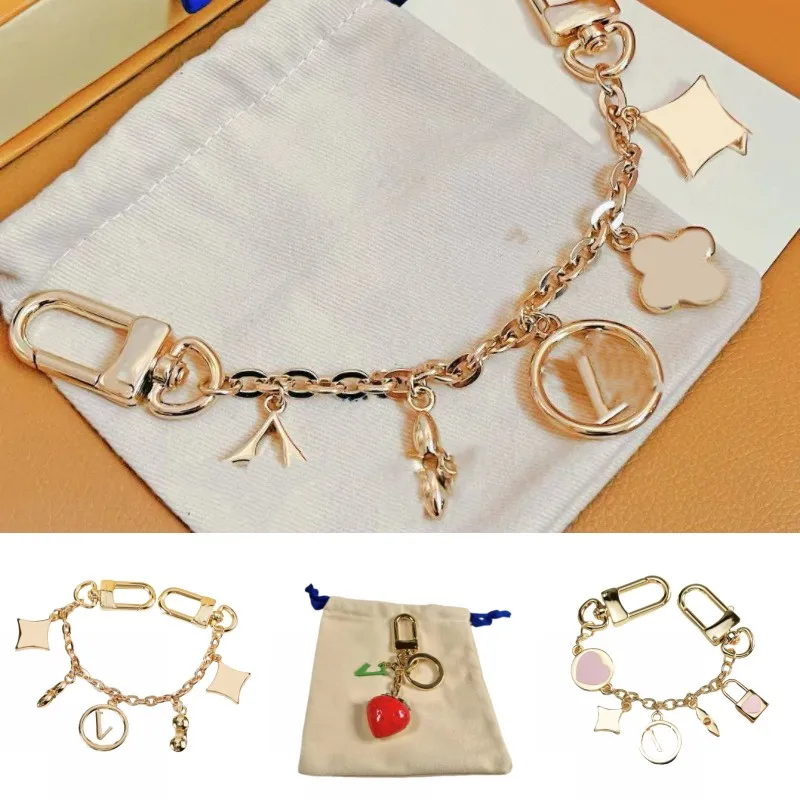Designer key chain gold color metal pendant purse charms stainless ...