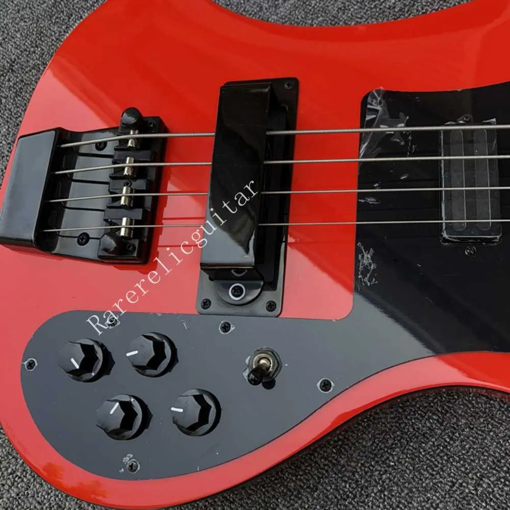 Red Electric Bass Guitar With Vintage Aesthetic And Triangle Inlays ...