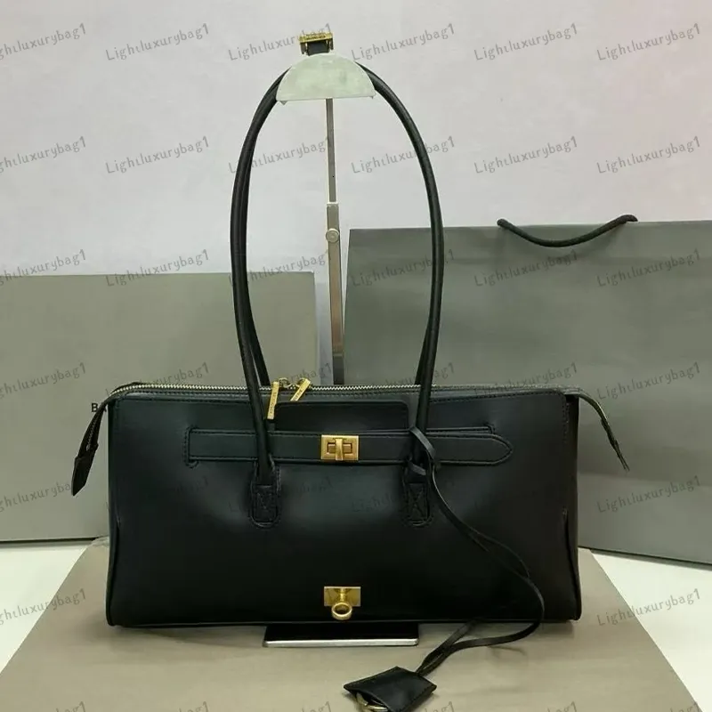 Designer Belair Underarm Bag: Minimalist Structure, Twist Lock Details ...