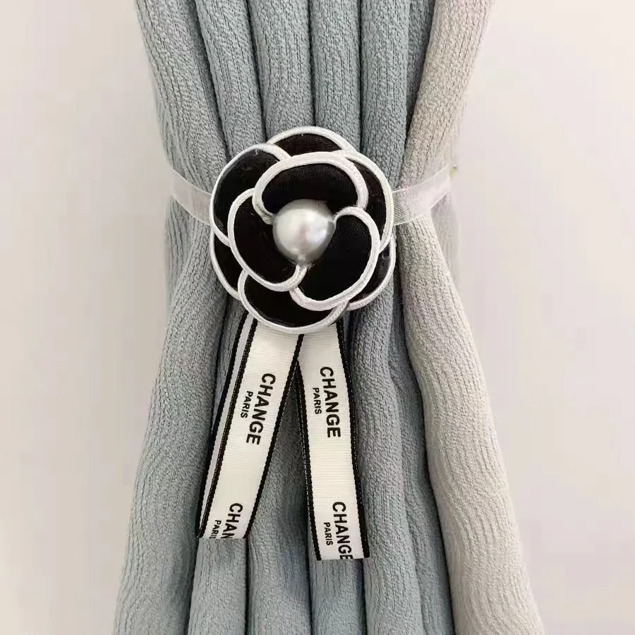 Camellia flower tiebacks vs. simple curtain cords: Which looks less ...