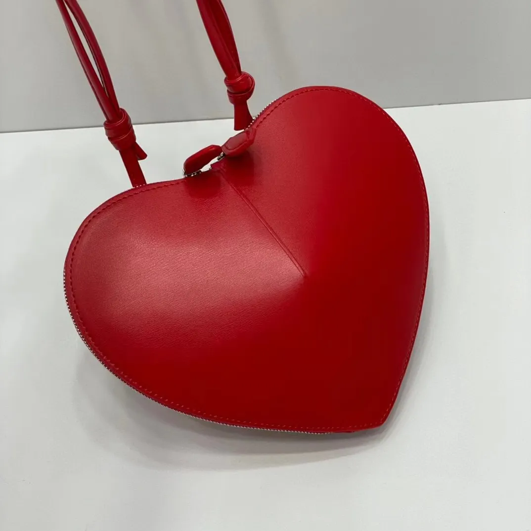designer handbag with heart logo