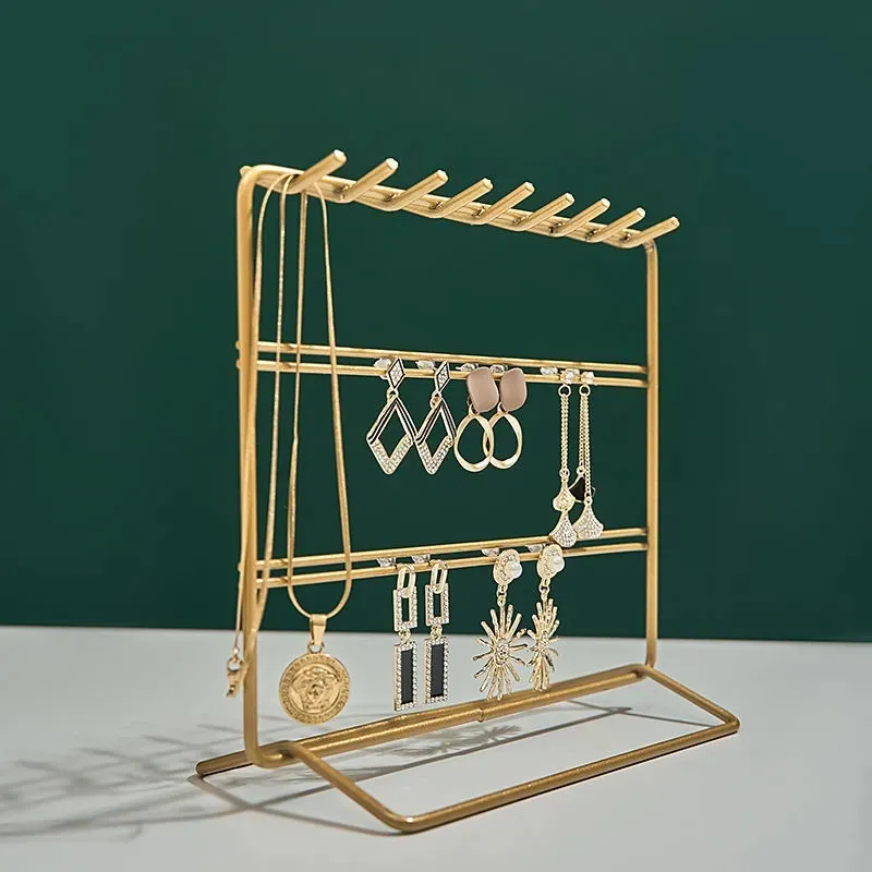 Metallic Elegance: Gold & Black Jewelry Display Stand for Rings ...