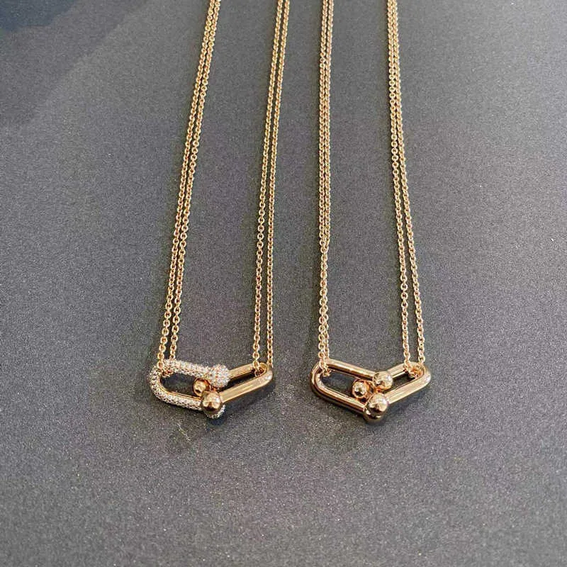 DHgate.com:2024Double Interlocking Horseshoe Necklace - V-Gold Material ...